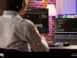 Software Developer Coding Firewall Server On Computer And Laptop Using