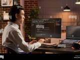Asian Programmer Using Binary Code To Script Security System