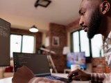 Free Photo African American Coder Programming Binary Code Interface