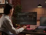 Asian Programmer Using Binary Code To Script Security System Stock