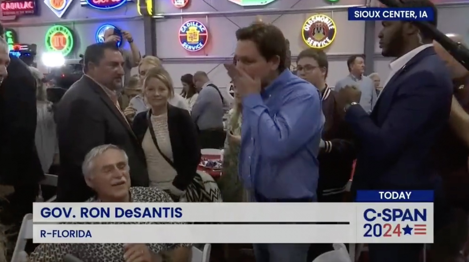 Ron DeSantis spreads wet cooties on his hand, then places said hand on ...