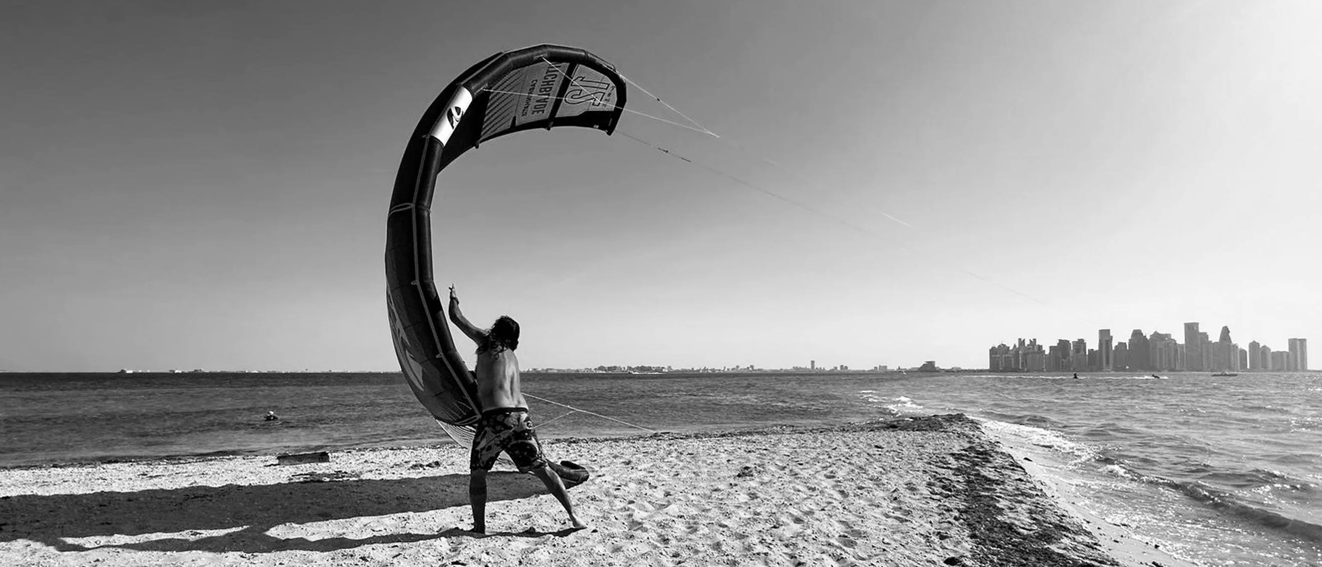 Kite Wing Shuttle To Our Spot On An Island In Front Of Dohas Skyline