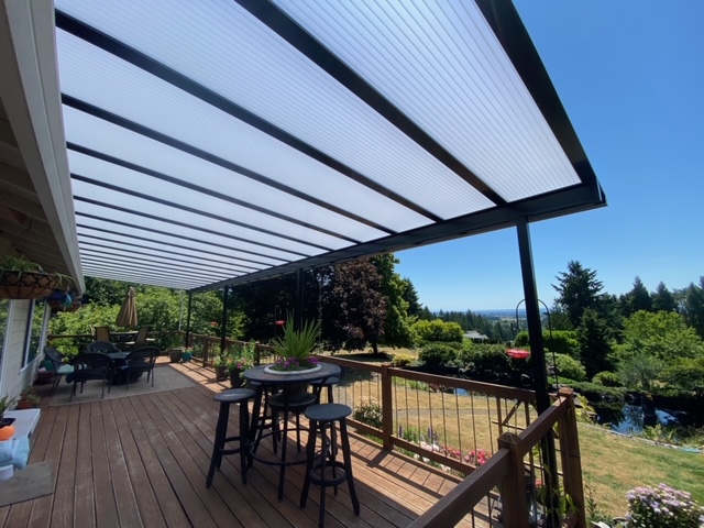 Acrylite patio cover with rain chains - Deck Masters, LLC