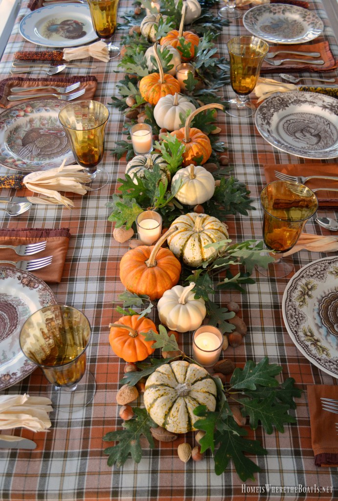 A Thanksgiving Table With Turkey Plates Plaid And Pumpkin Oak Leaf a-thanksgiving-table-with-turkey-plates-plaid-and-pumpkin-oak-leaf