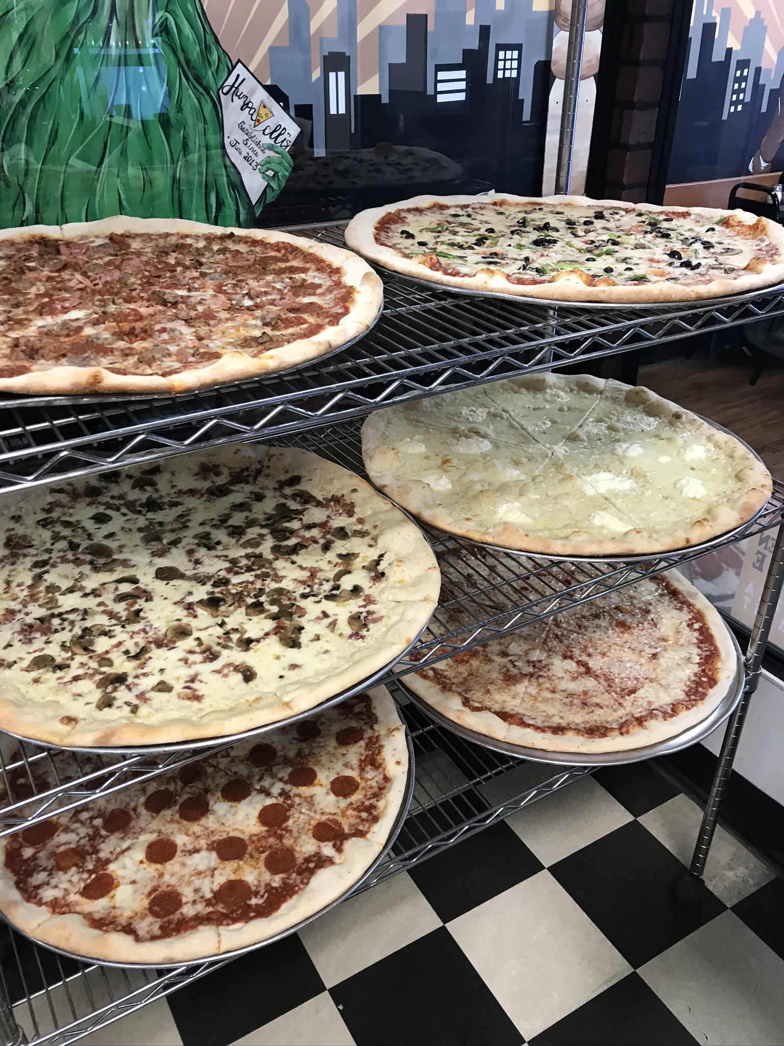 slice window 9 – Authentic New York Style Hand Tossed Pizza
