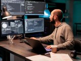 Premium Photo Software Developer Coding Database On Multiple Monitors