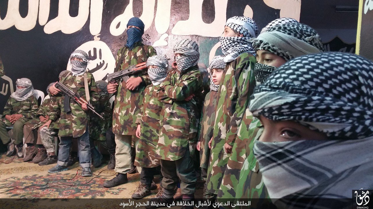 ISIS news: Daesh release photos of children preaching and holding guns ...