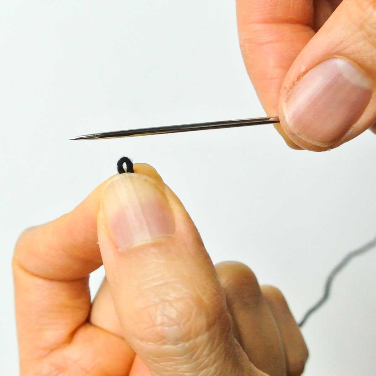 How to Easily Thread a Sewing Needle: 10+ Hacks - Mindy Makes