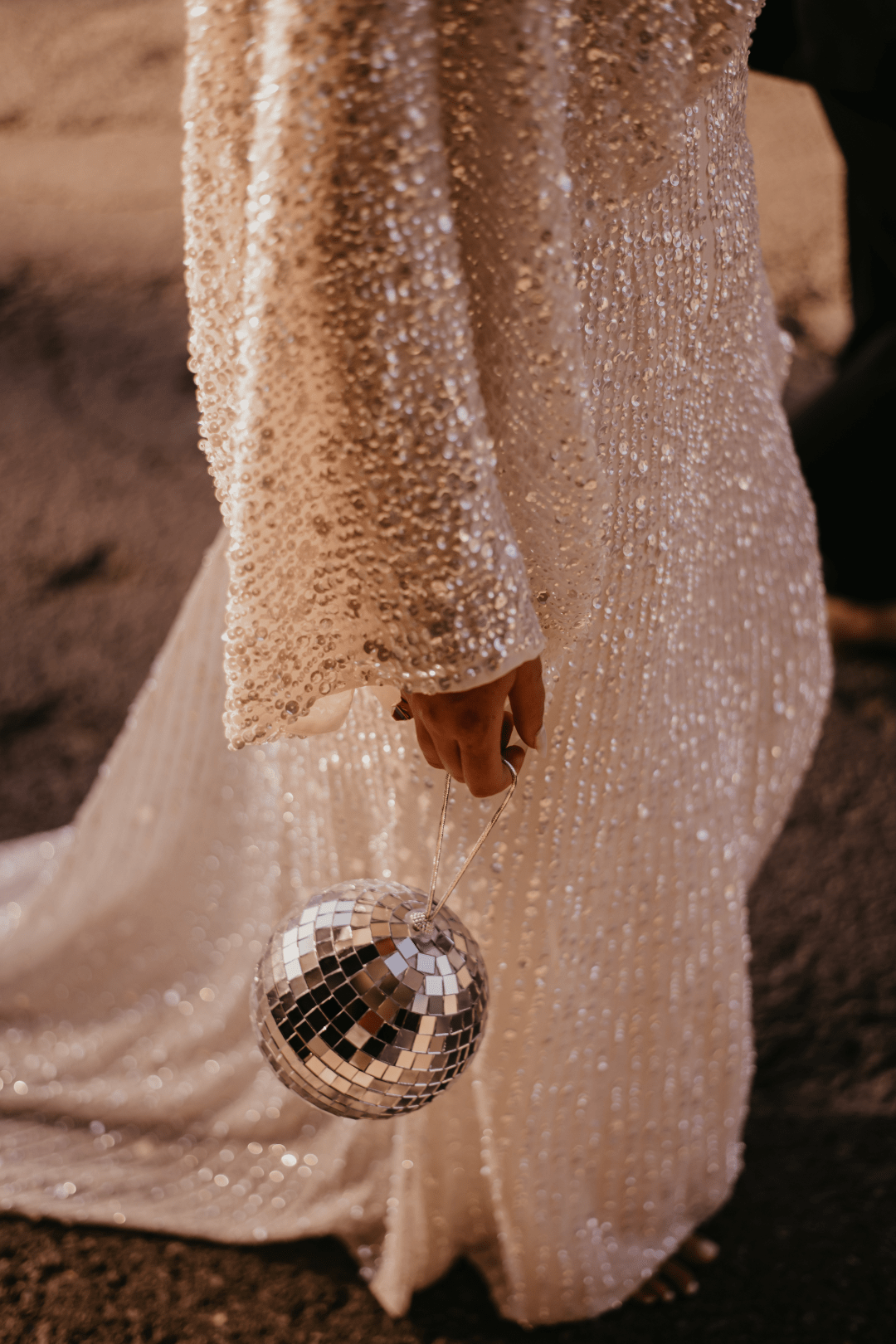 A colorful wedding with a pink pantsuit and a disco wedding dress ...