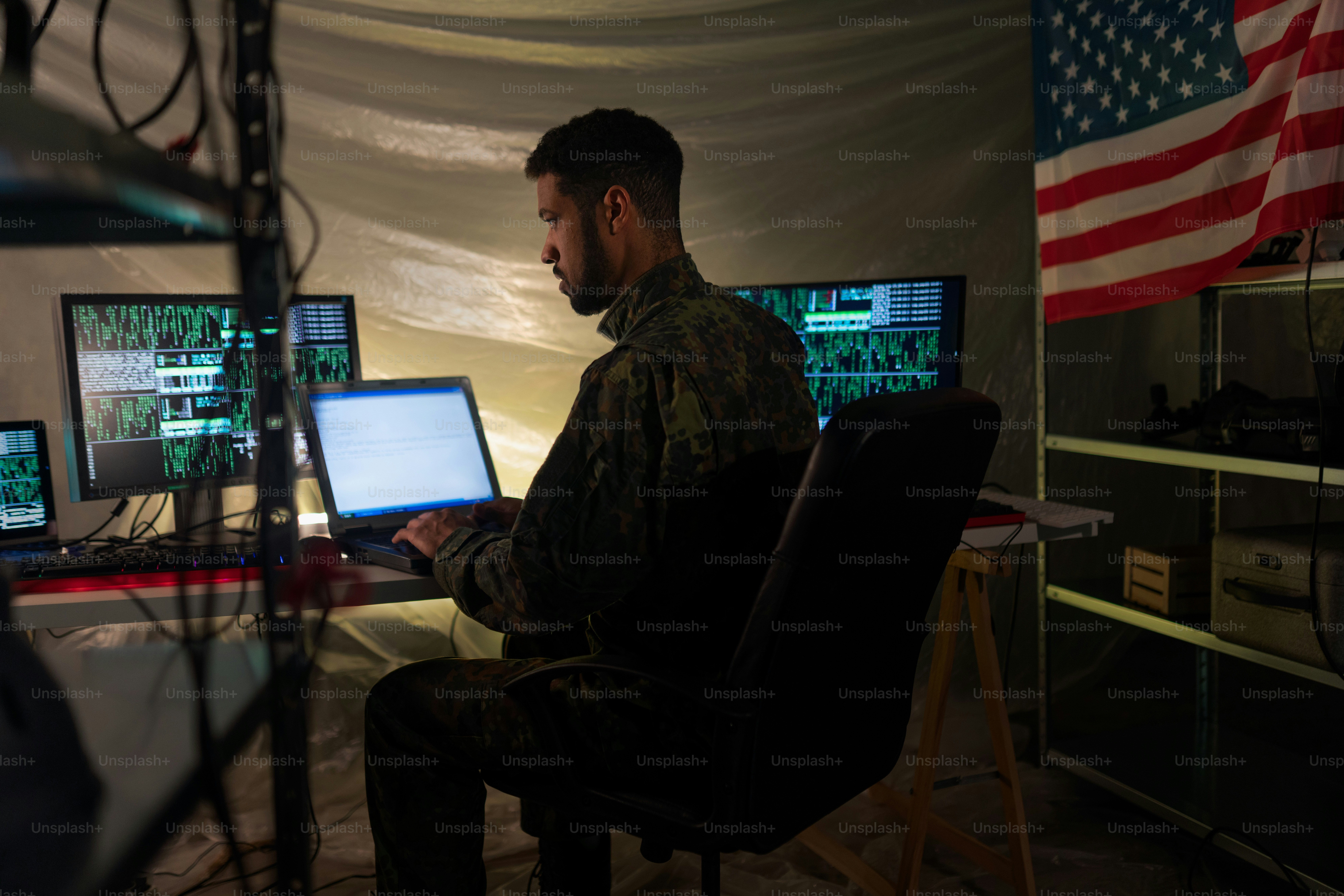 A Hacker In Military Unifrorm On Dark Web Cyberwar Concept Photo