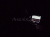 Hacker Concept Using A Computer With Stong Lighting And Dramatic