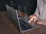 Hands Of A Programmer Types On A Laptop Displaying Programming Code