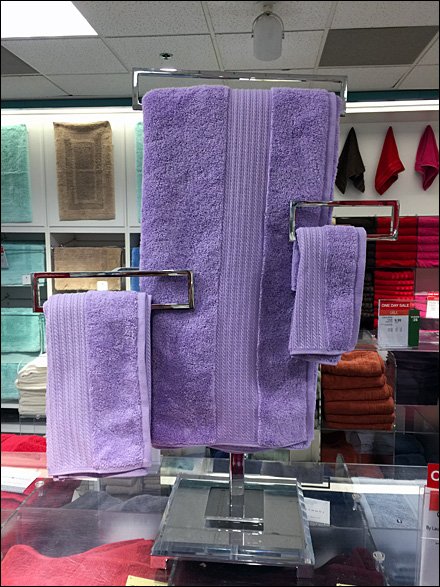 Towel Contemporary Trestle Table Display Minimizes Visual Clutter ...