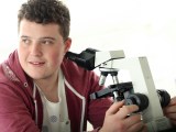 Horticulture Student With Microscope Reaseheath College