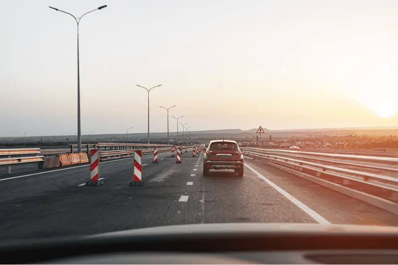 When is it legal to back up on an expressway?