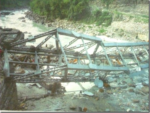 Nepal & NepaliA truss bridge, collapsed before completion